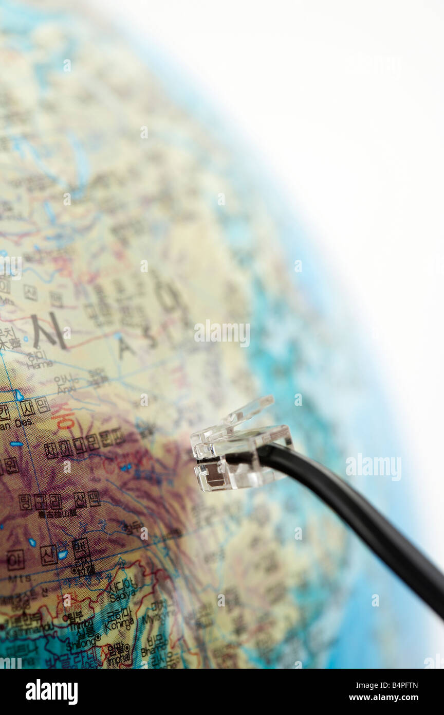 Globe with telephone cable Stock Photo - Alamy