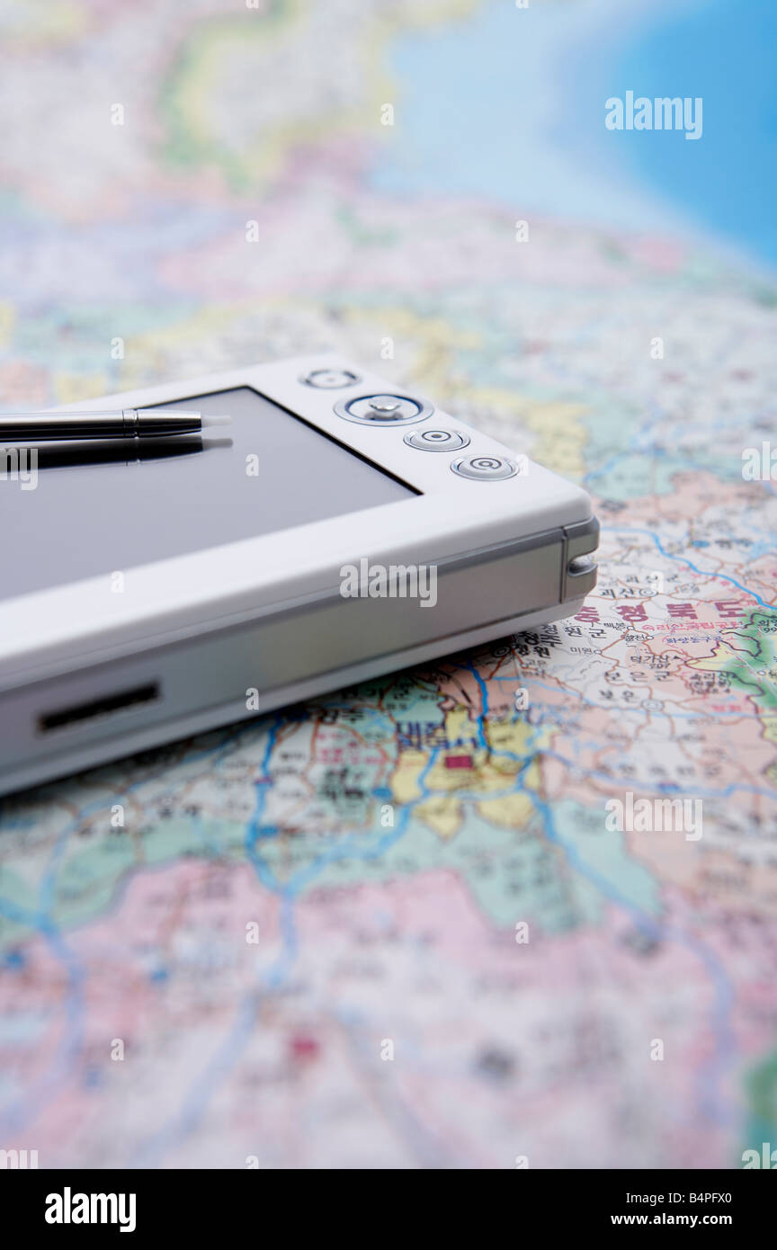 Mobile phone and stylus on world map Stock Photo - Alamy