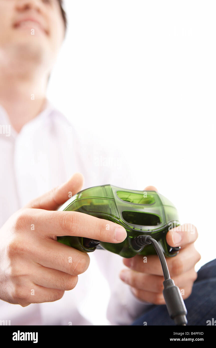 Man using video game controller Stock Photo - Alamy