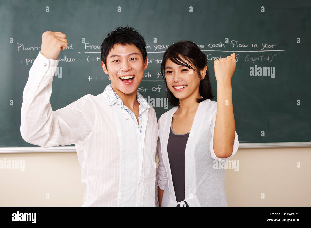 Students cheering in classroom hi-res stock photography and images - Alamy