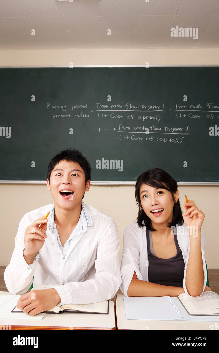 Sitting hand raised classroom education blackboard hi-res stock ...