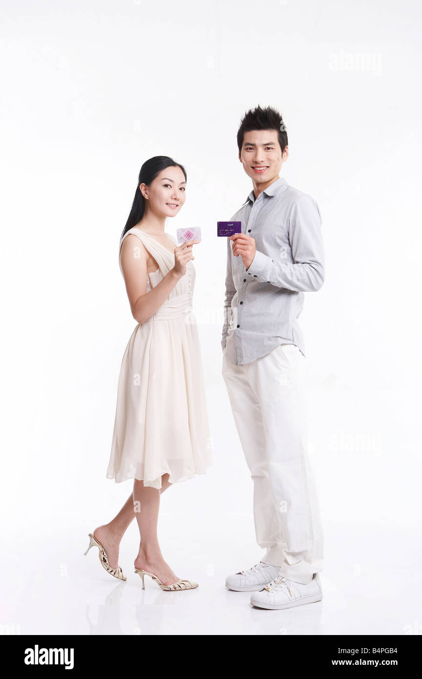 Young couple holding credit card Stock Photo - Alamy