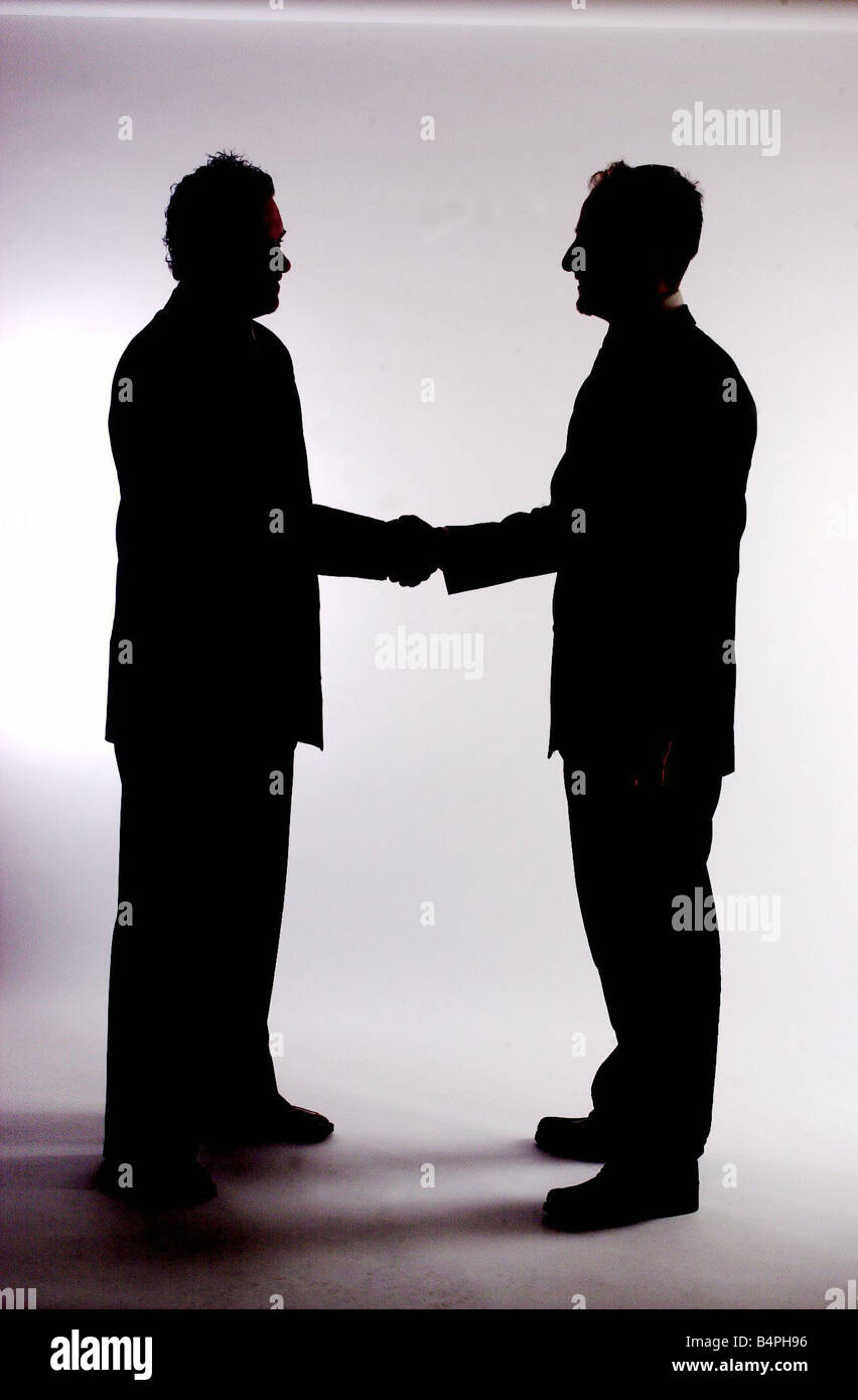 Two men shake hands 20th Jan 2004 Stock Photo - Alamy