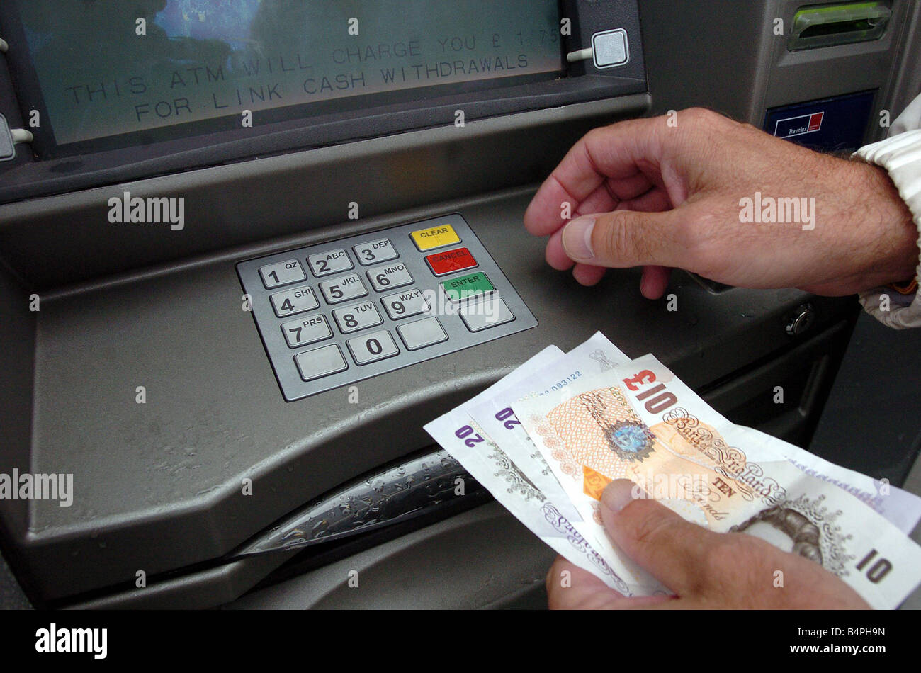 A picture to illustrate using a cashpoint 28th July 2005 Stock Photo ...