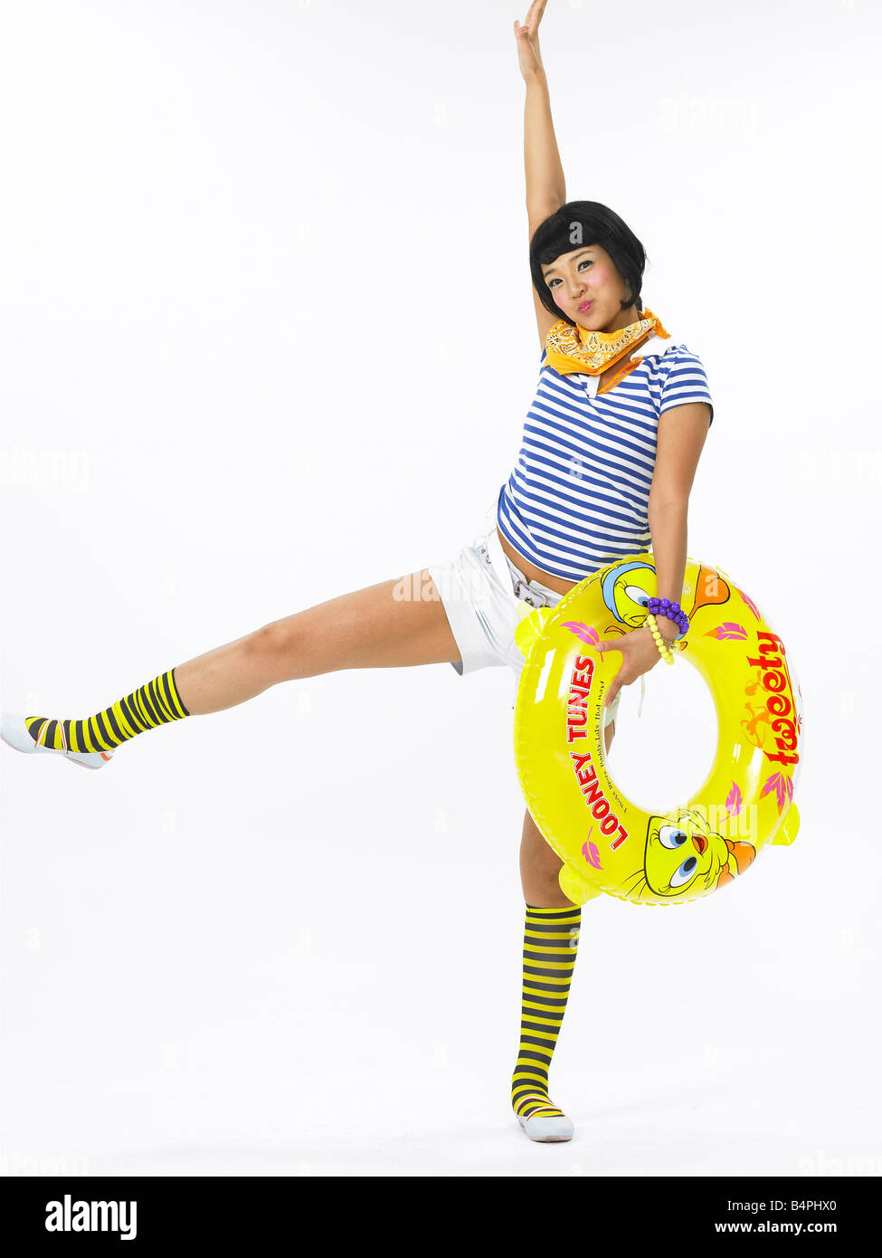 Portrait of woman holding inflatable ring Stock Photo - Alamy