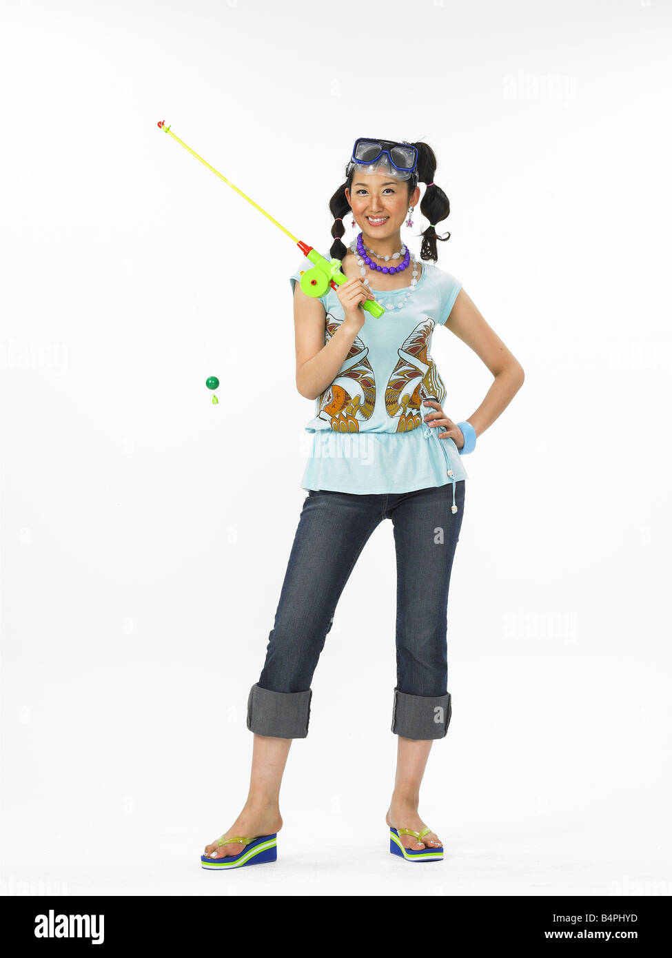 Woman Holding Fishing Rod With One Hand High Resolution Stock ...