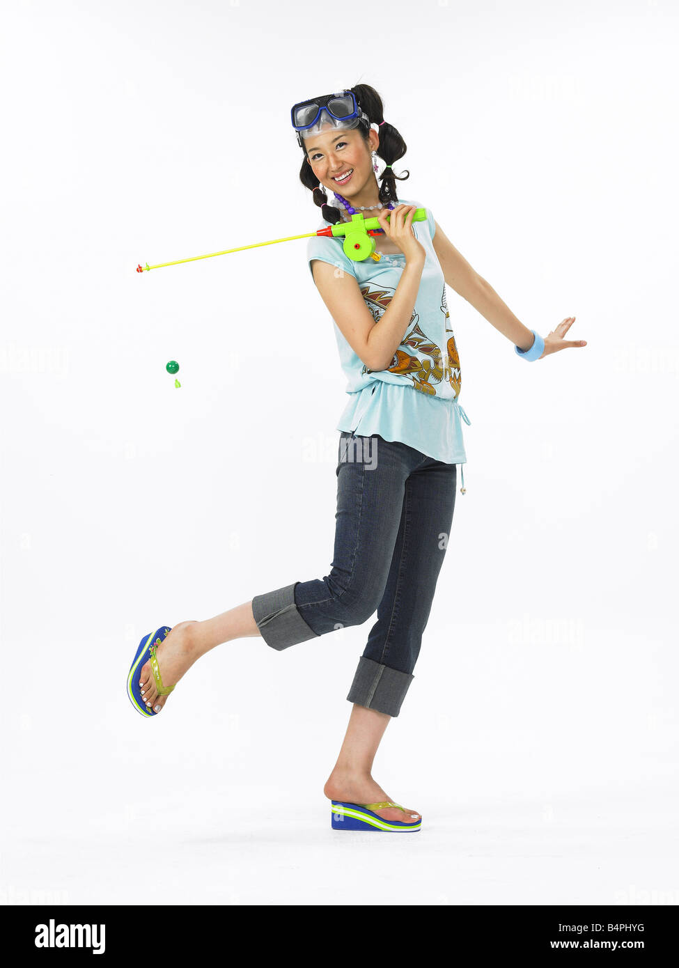 Woman holding fishing rod with one hand hi-res stock photography and ...