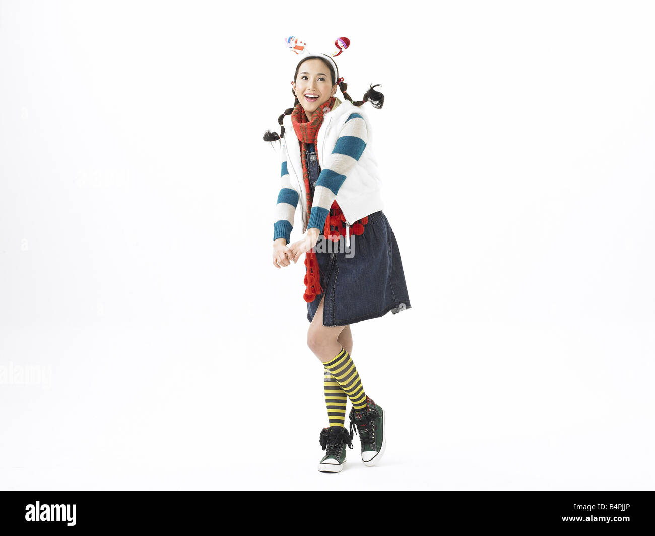 Young woman dancing, smiling Stock Photo - Alamy