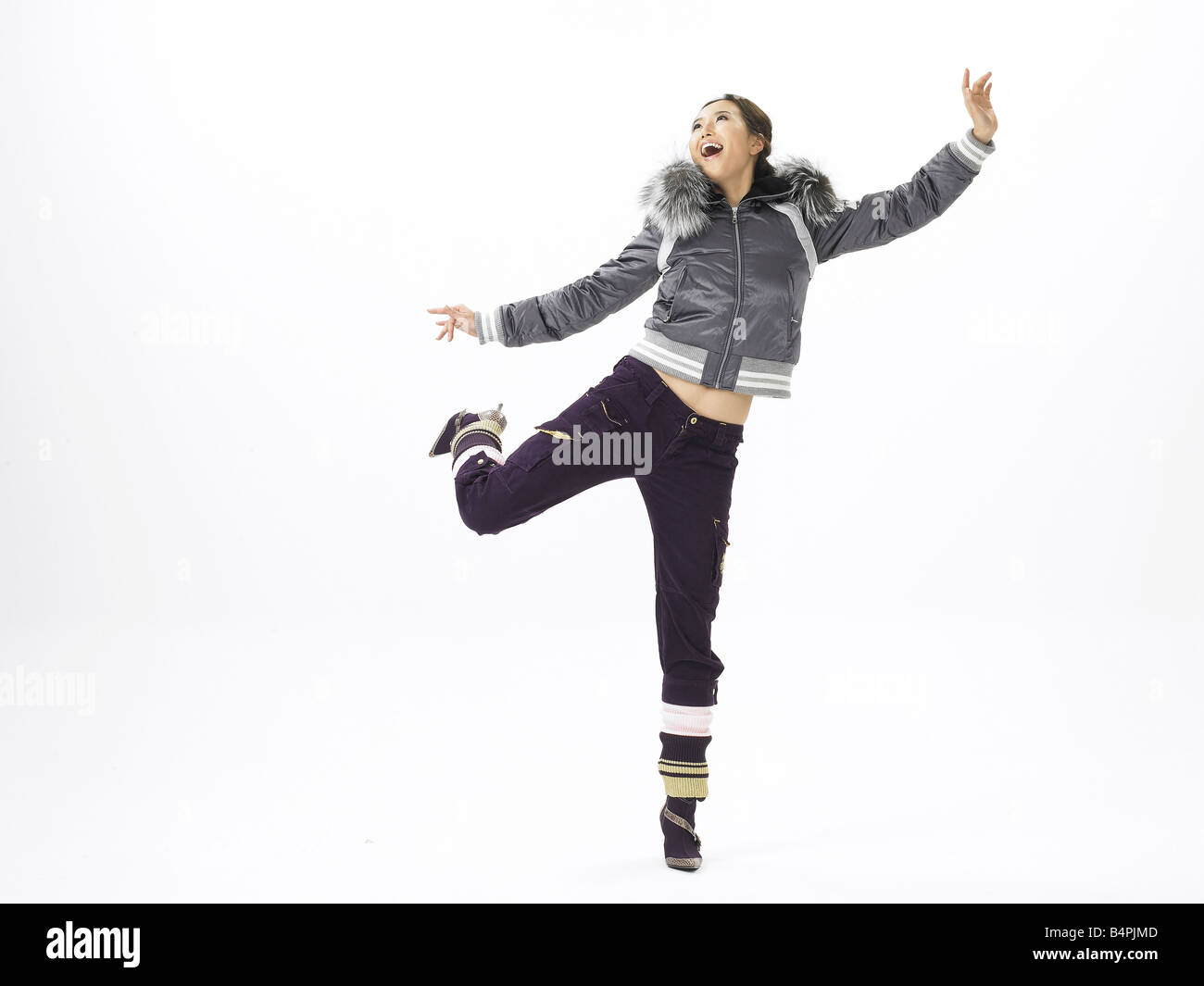 Young woman dancing, smiling Stock Photo - Alamy