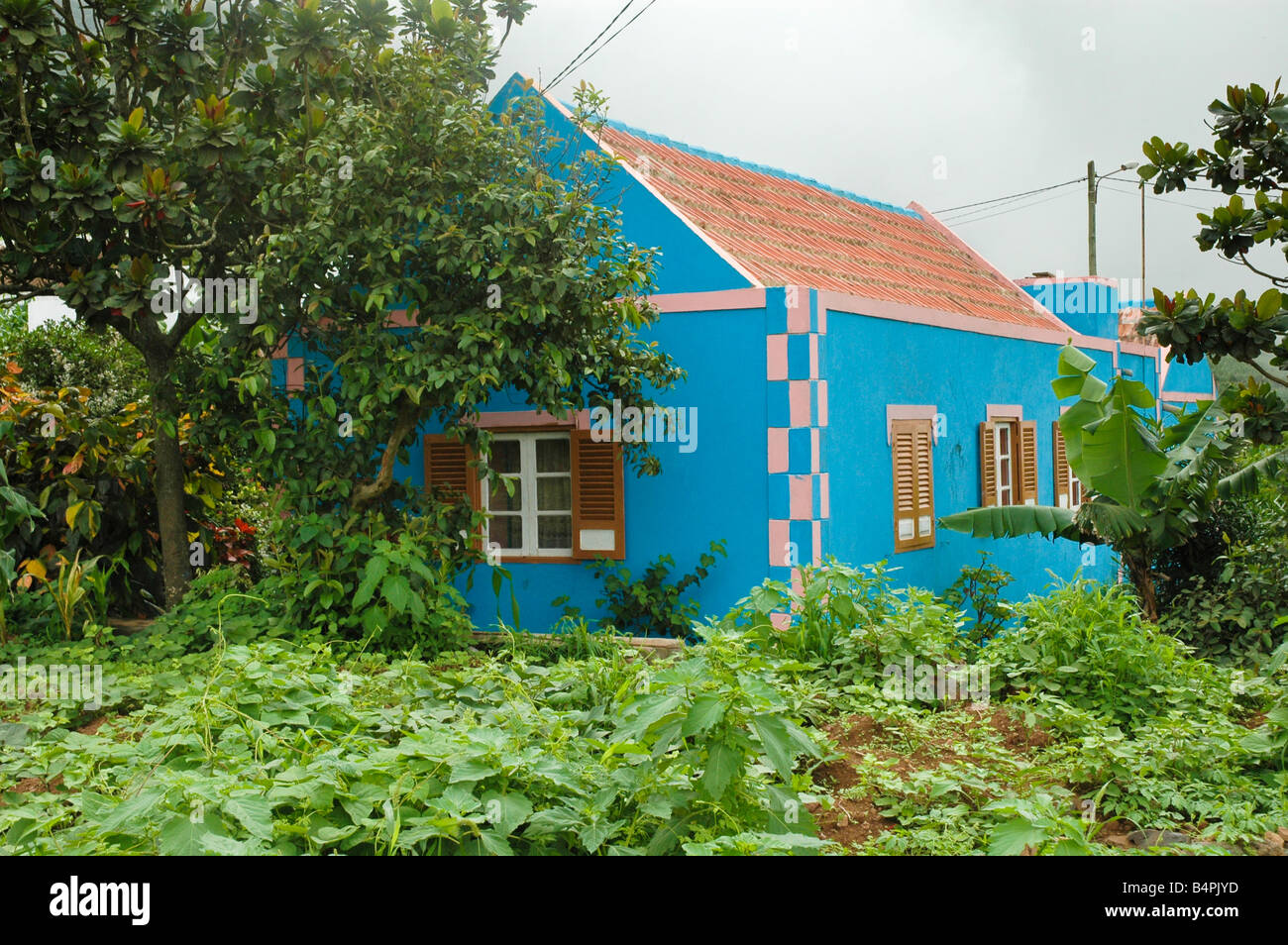 blue painted farm house Stock Photo - Alamy