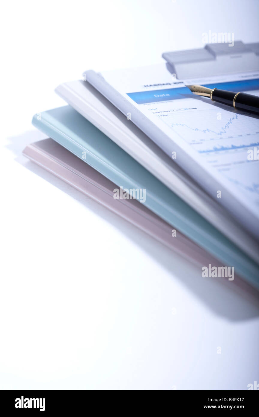 Financial paper with fountain pen Stock Photo - Alamy