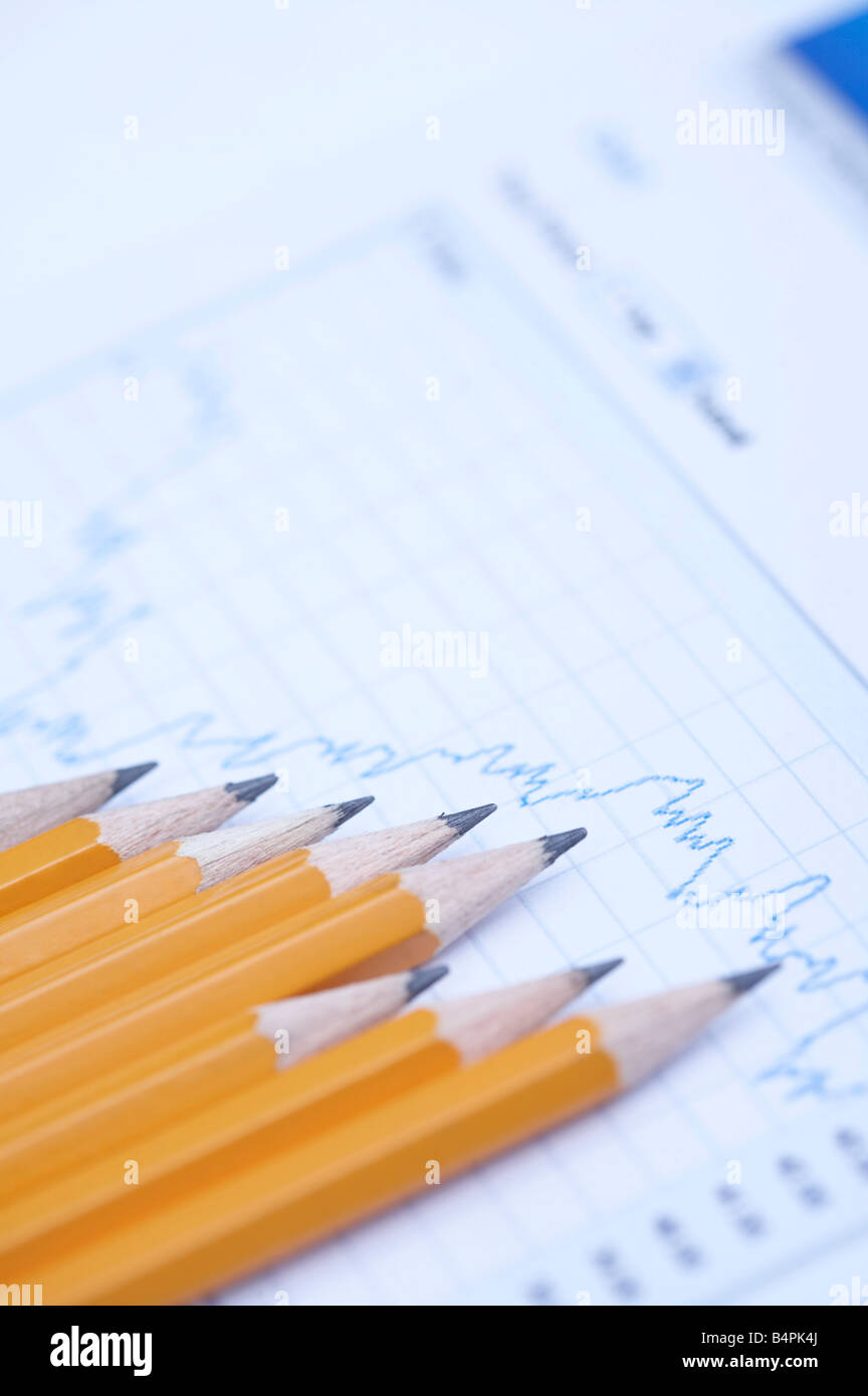 Financial paper with pencil Stock Photo - Alamy