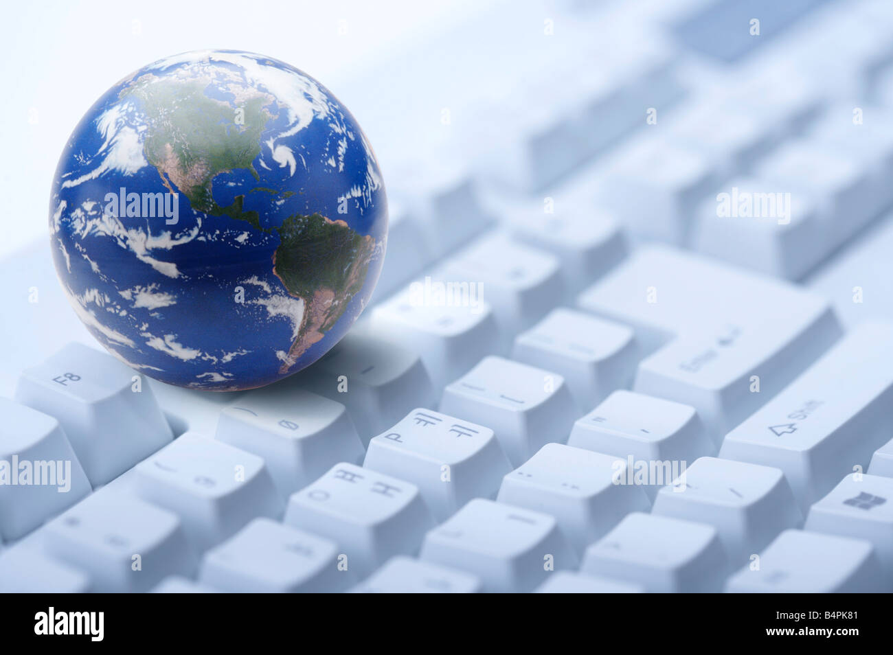 Computer keyboard with globe, close-up Stock Photo - Alamy