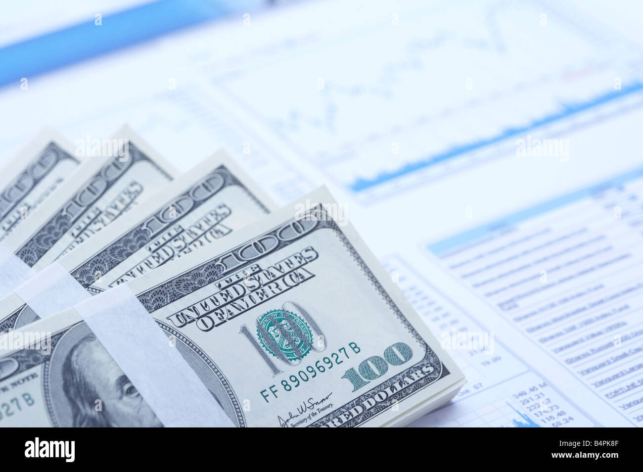 Paper currency on financial paper Stock Photo - Alamy