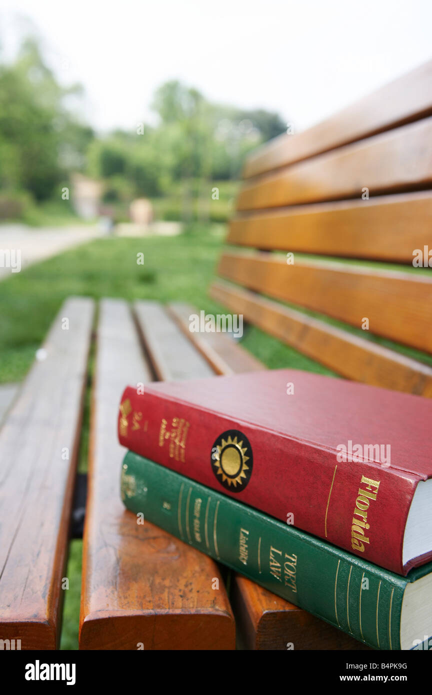 Books on bench at corner, close-up Stock Photo - Alamy