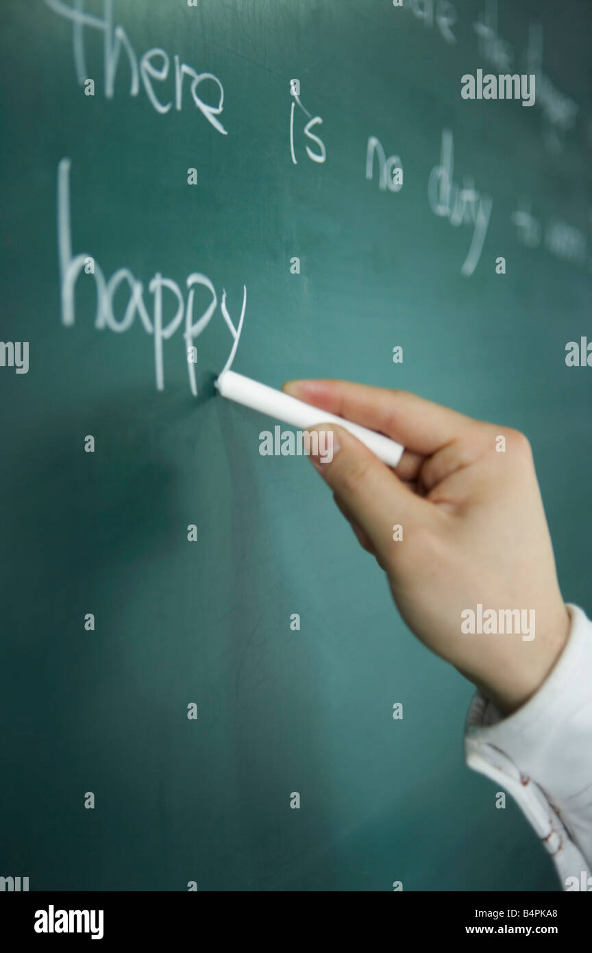 Teacher Writing On Blackboard Stock Photos & Teacher Writing On ...