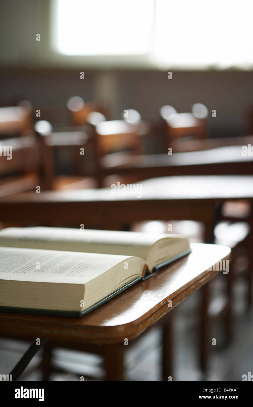 Open book on wooden bench, close-up Stock Photo - Alamy