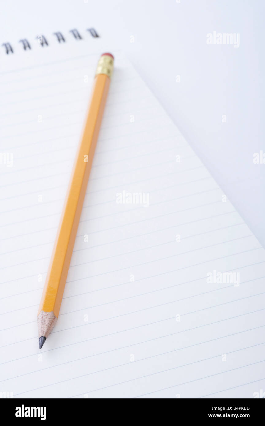 Spiral notebook with pencil Stock Photo - Alamy