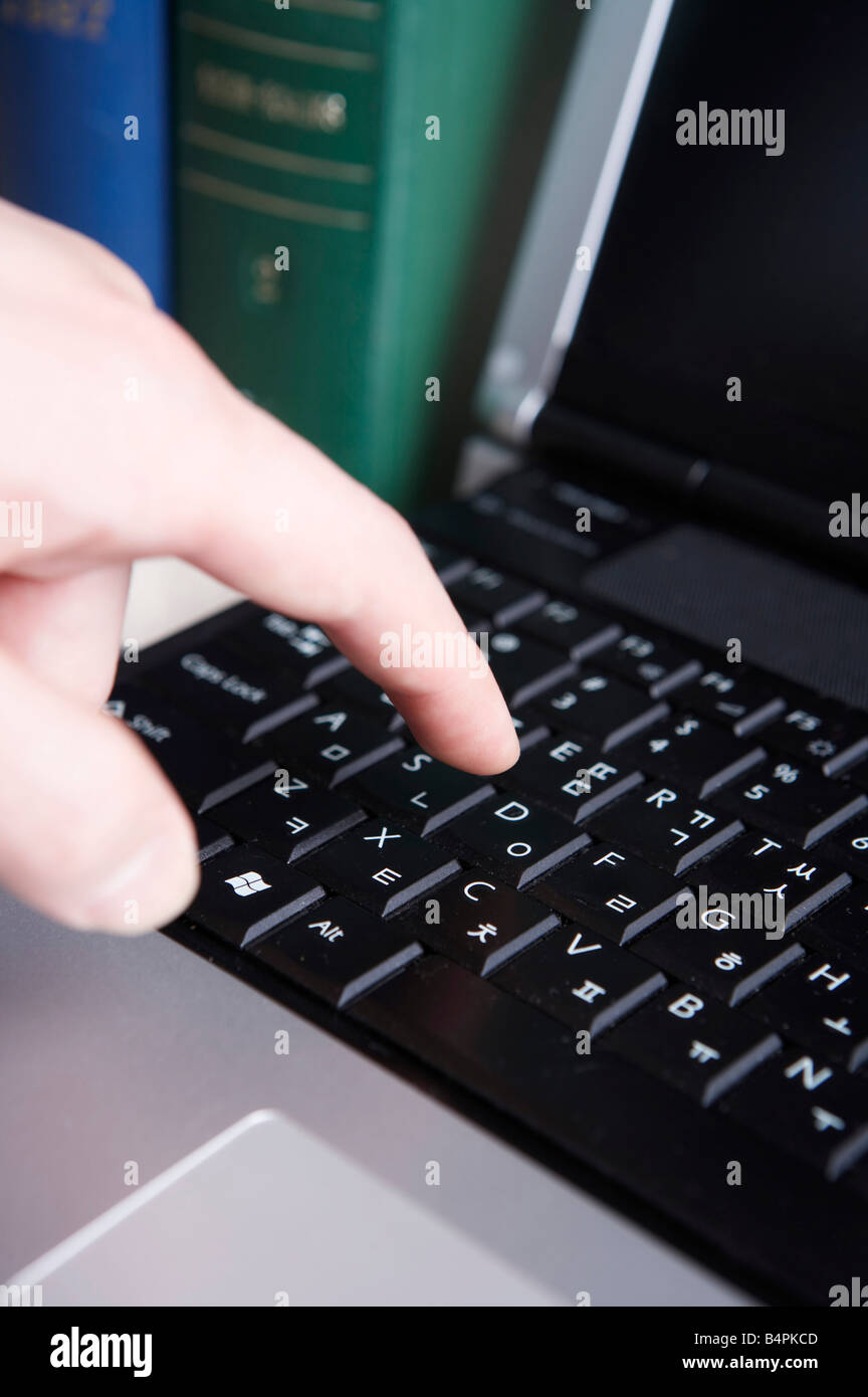 Human finger about to press laptop button, close-up Stock Photo - Alamy