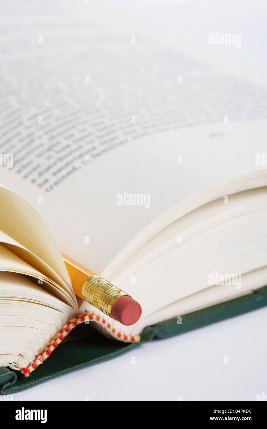 Pencil on open book Stock Photo - Alamy