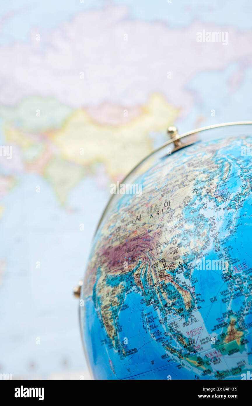 Globe with world map in the background Stock Photo - Alamy