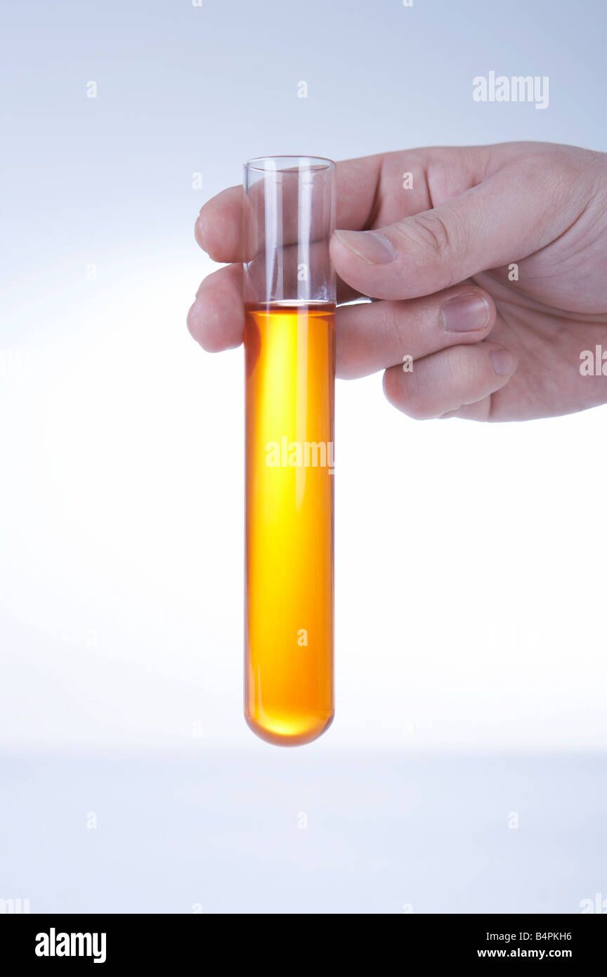 Hand with test tubes and reagents hi-res stock photography and images ...