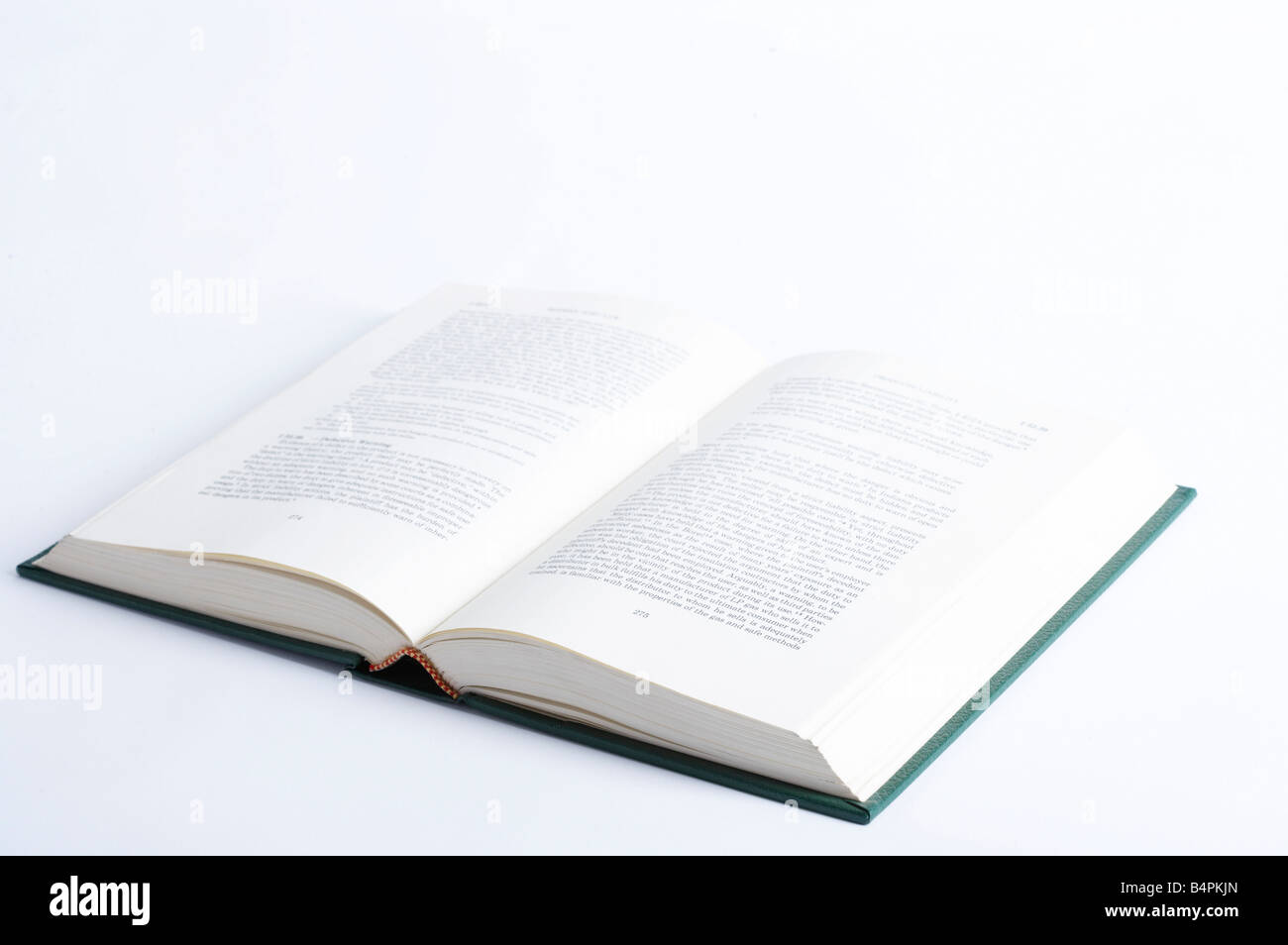 Paper weight on open book, close-up Stock Photo - Alamy