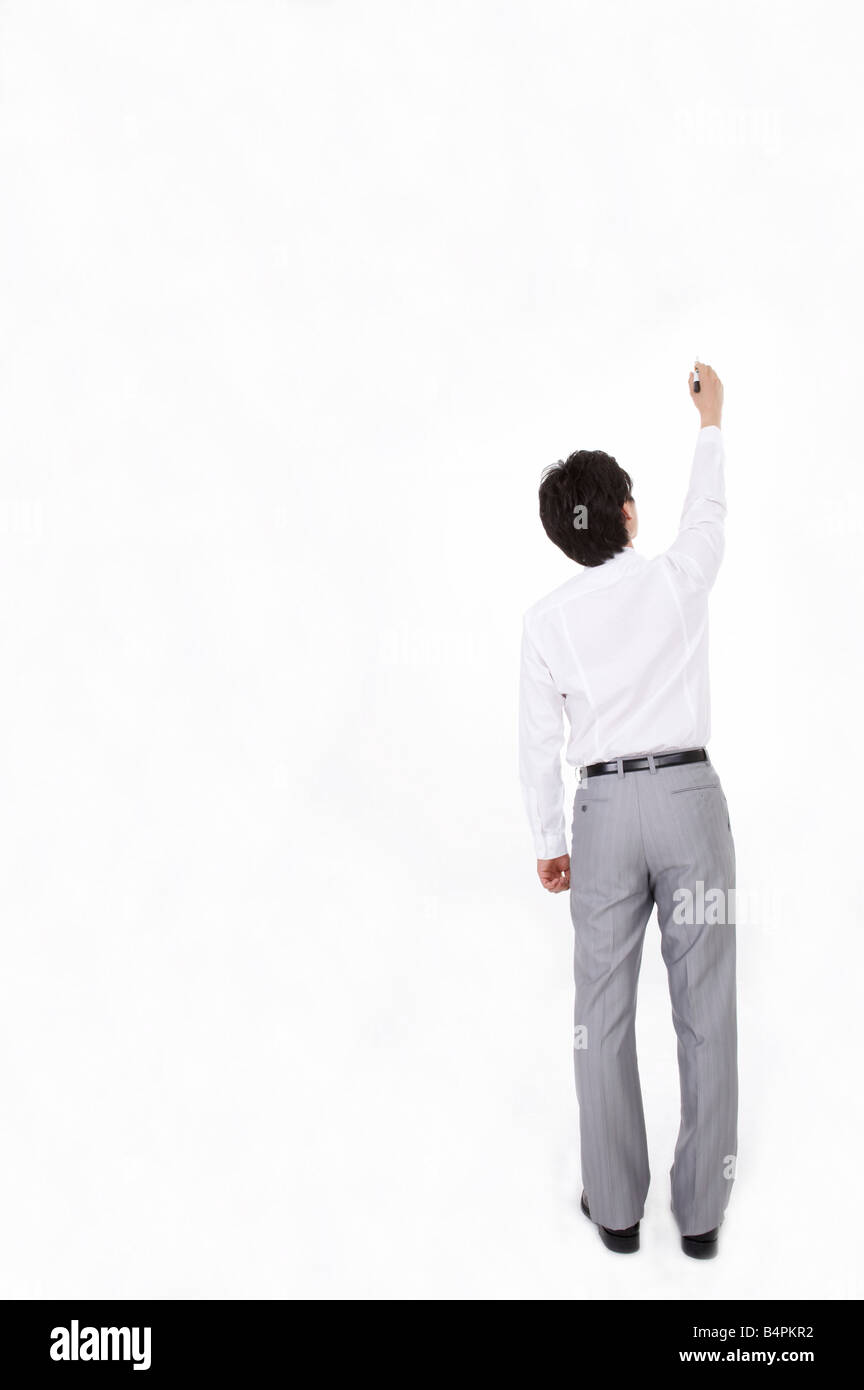 Rear view of a businessman against white background Stock Photo - Alamy