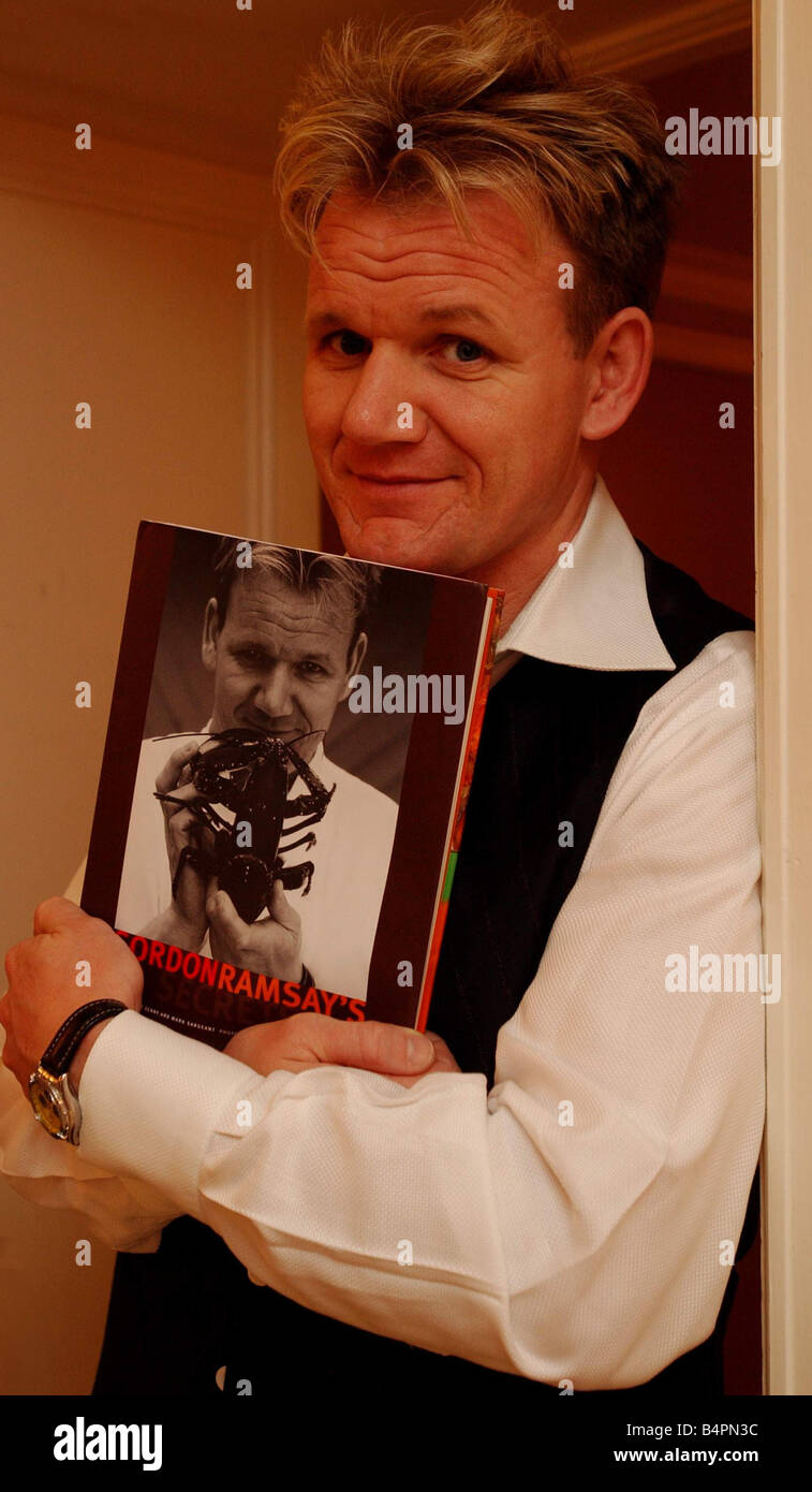 Gordon Ramsay at his book signing in Edinburgh holding a copy of his ...