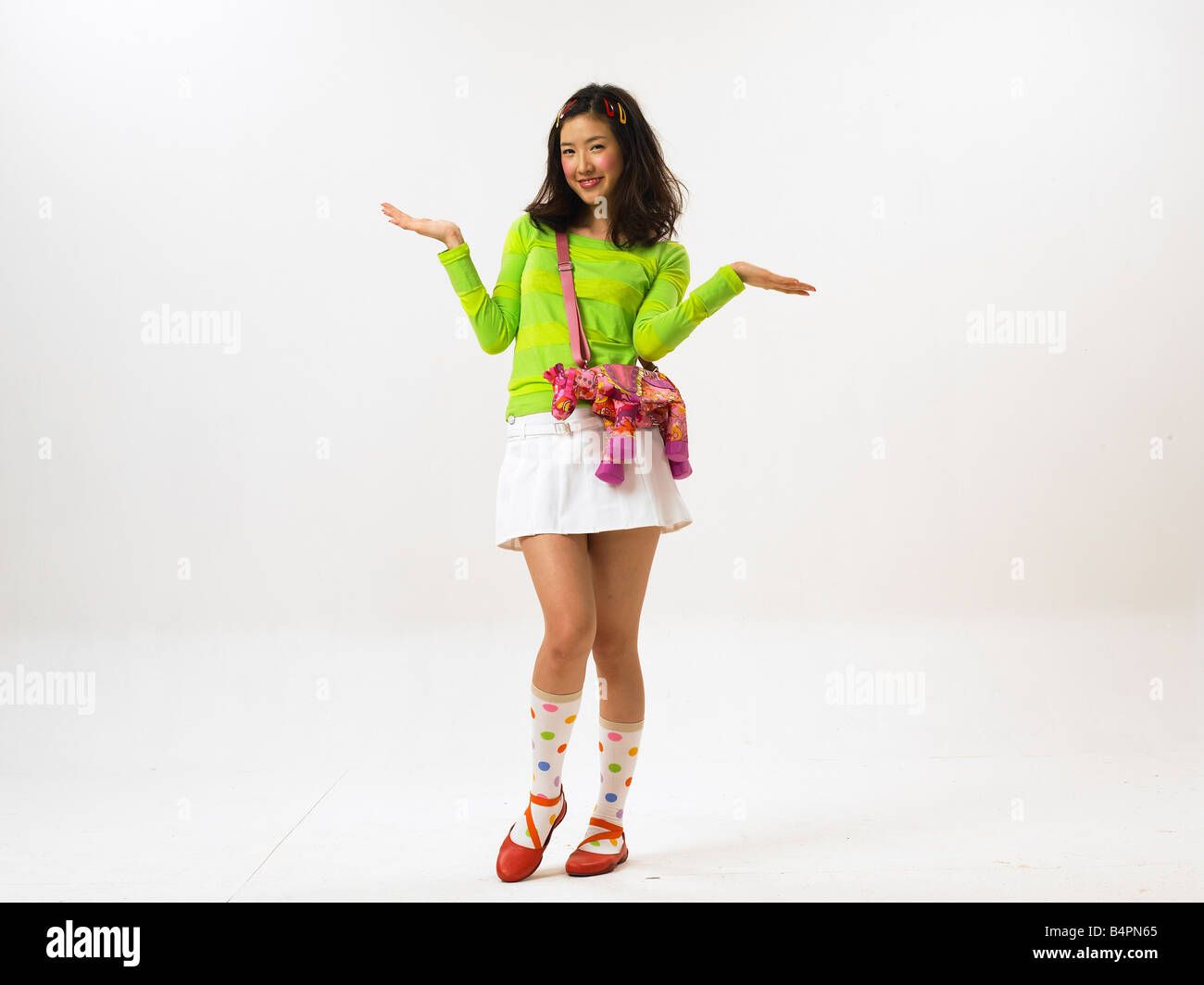 Young woman giving hand sign, portrait Stock Photo - Alamy