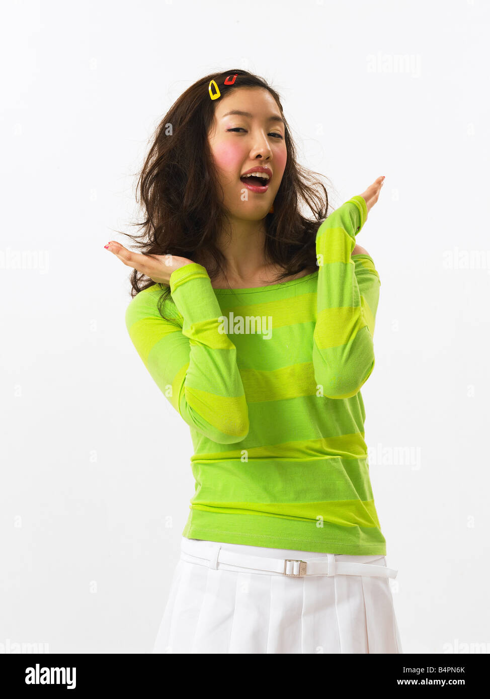 Young woman giving hand sign, portrait Stock Photo - Alamy