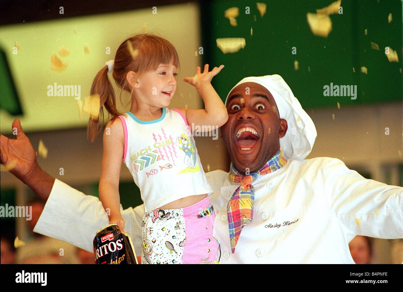 TV chef Ainsley Harrott at Clydebank Shopping Centre with a little girl ...