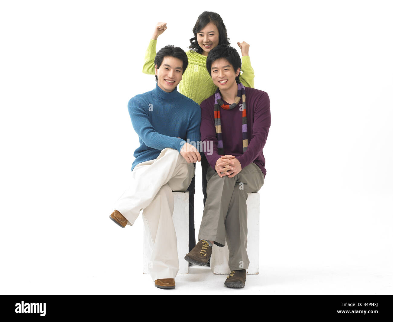 Portrait of friends smiling against white background Stock Photo - Alamy