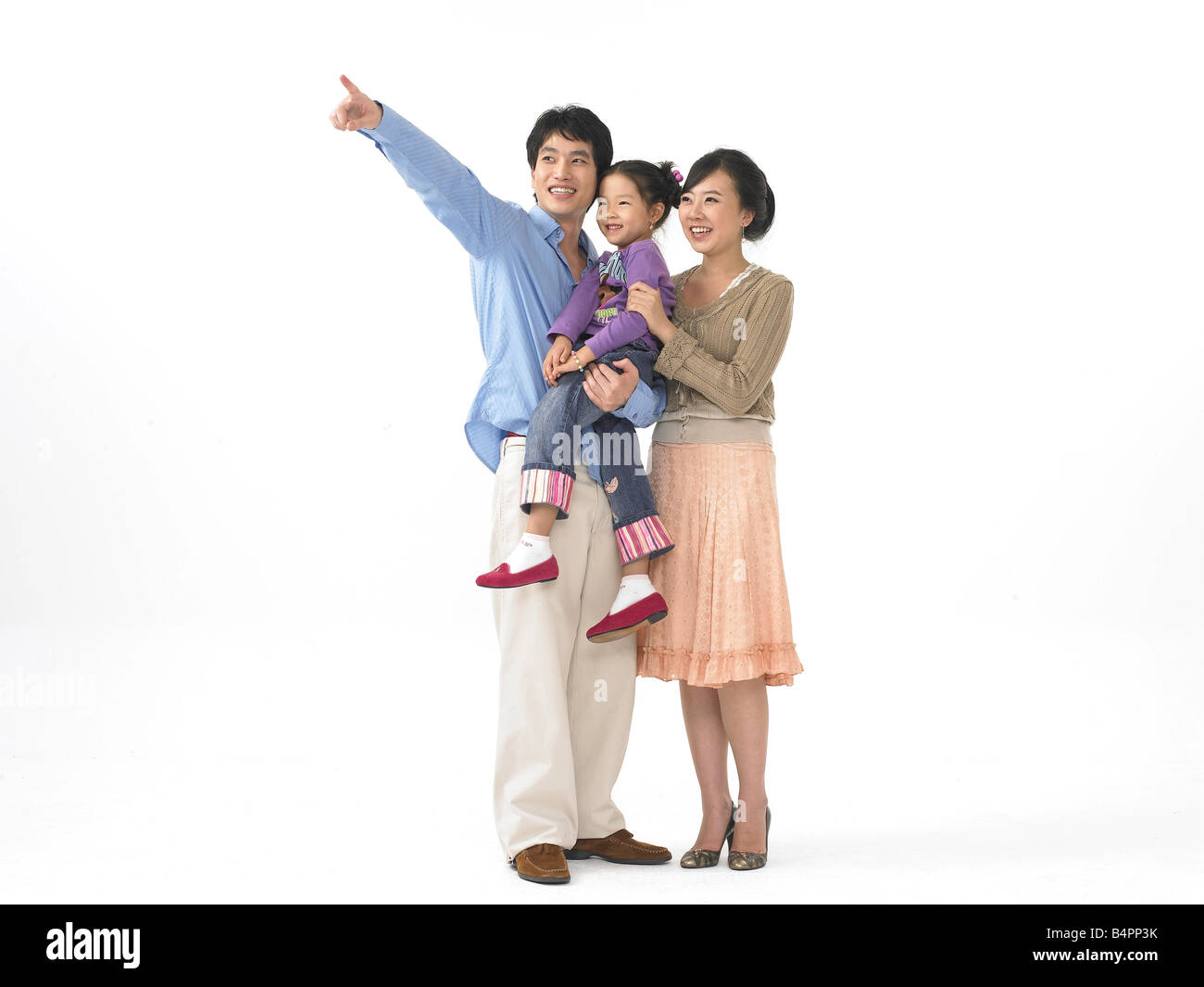 Parents with daughter, father pointing Stock Photo - Alamy