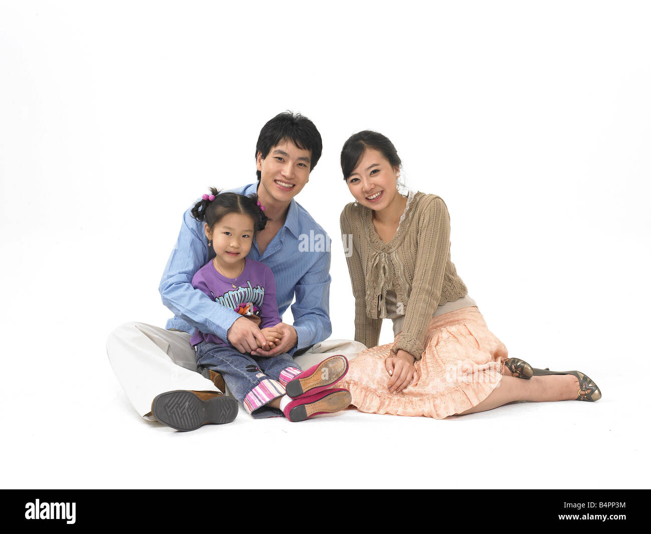 Parents with daughter against white background Stock Photo - Alamy