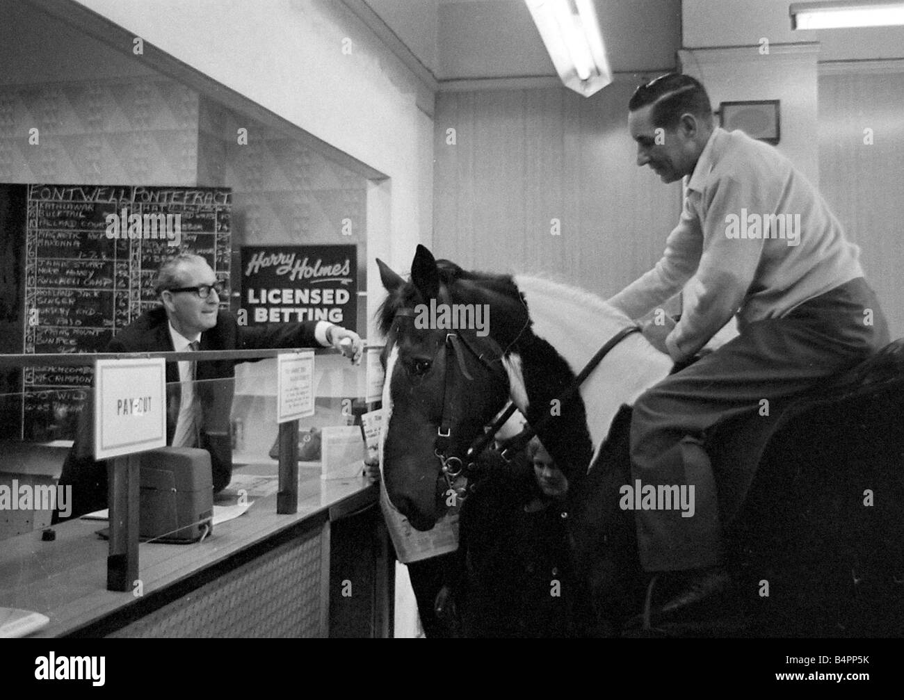 A member of the stables at Bramdean Riding School in London makes a ...