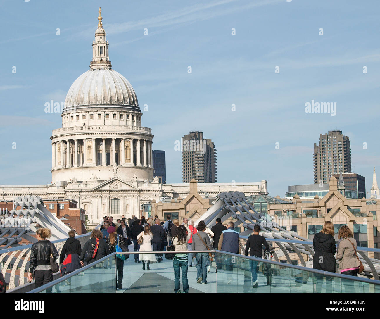 Crowds walking across pedestrian bridge hi-res stock photography and ...