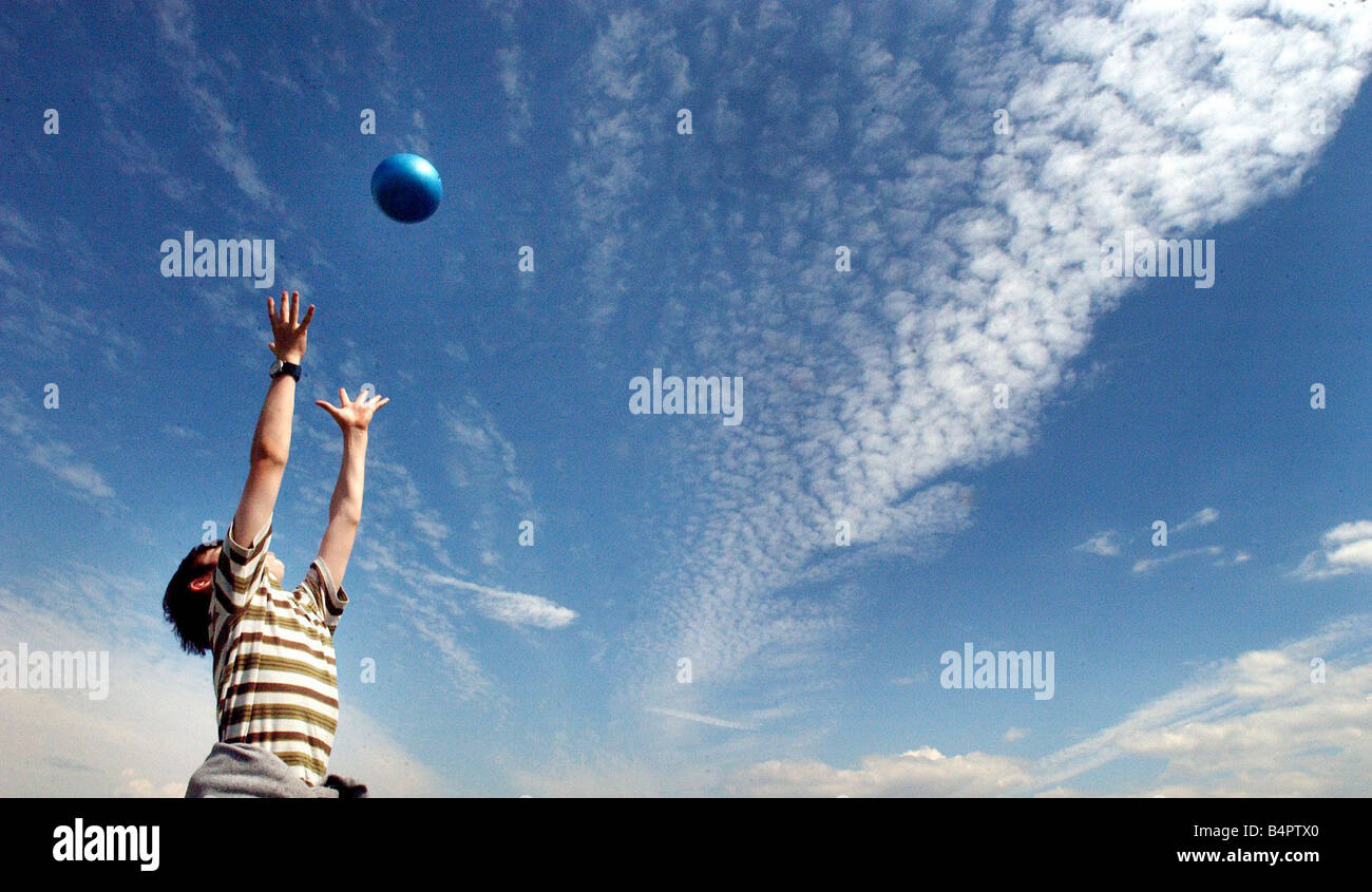 Child about to catch a ball hi-res stock photography and images - Alamy