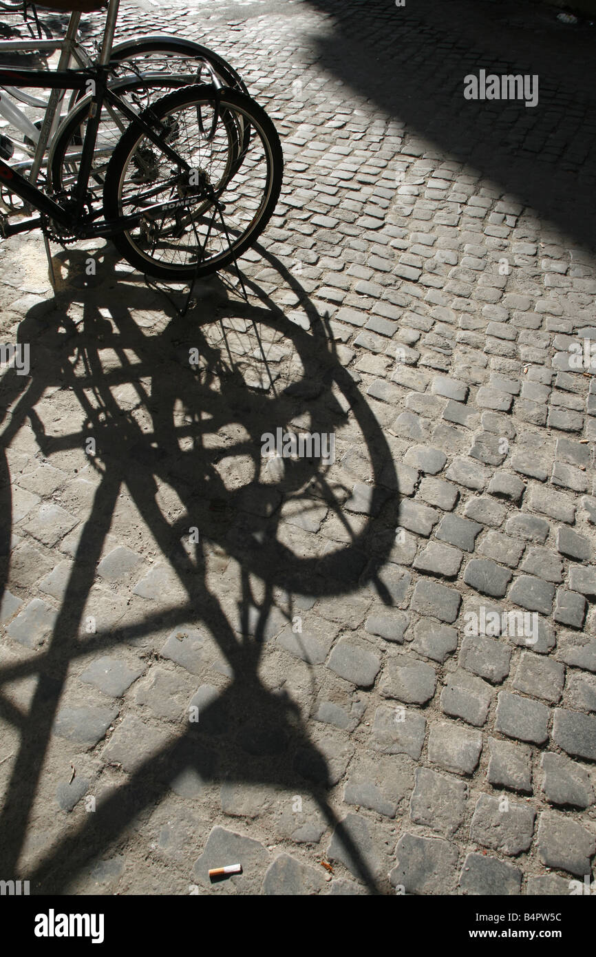 bikes shadow on sidewalk road in sun Stock Photo - Alamy