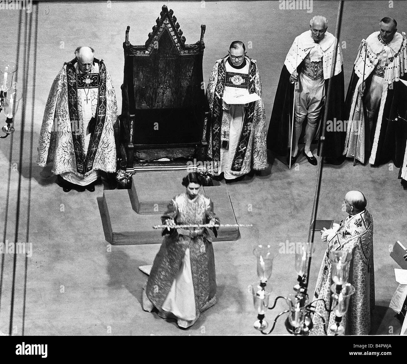Queen Elizabeth holds a sword during Coronation ceremony June 1953 ...