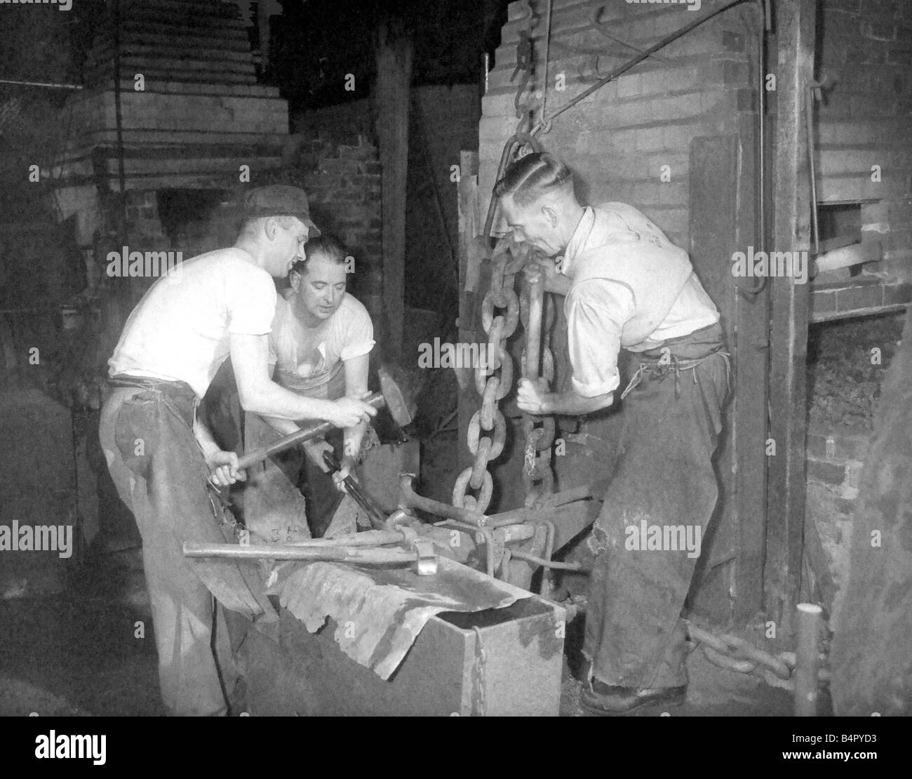 Chain making is a hot slogging job but three who are used to the work ...
