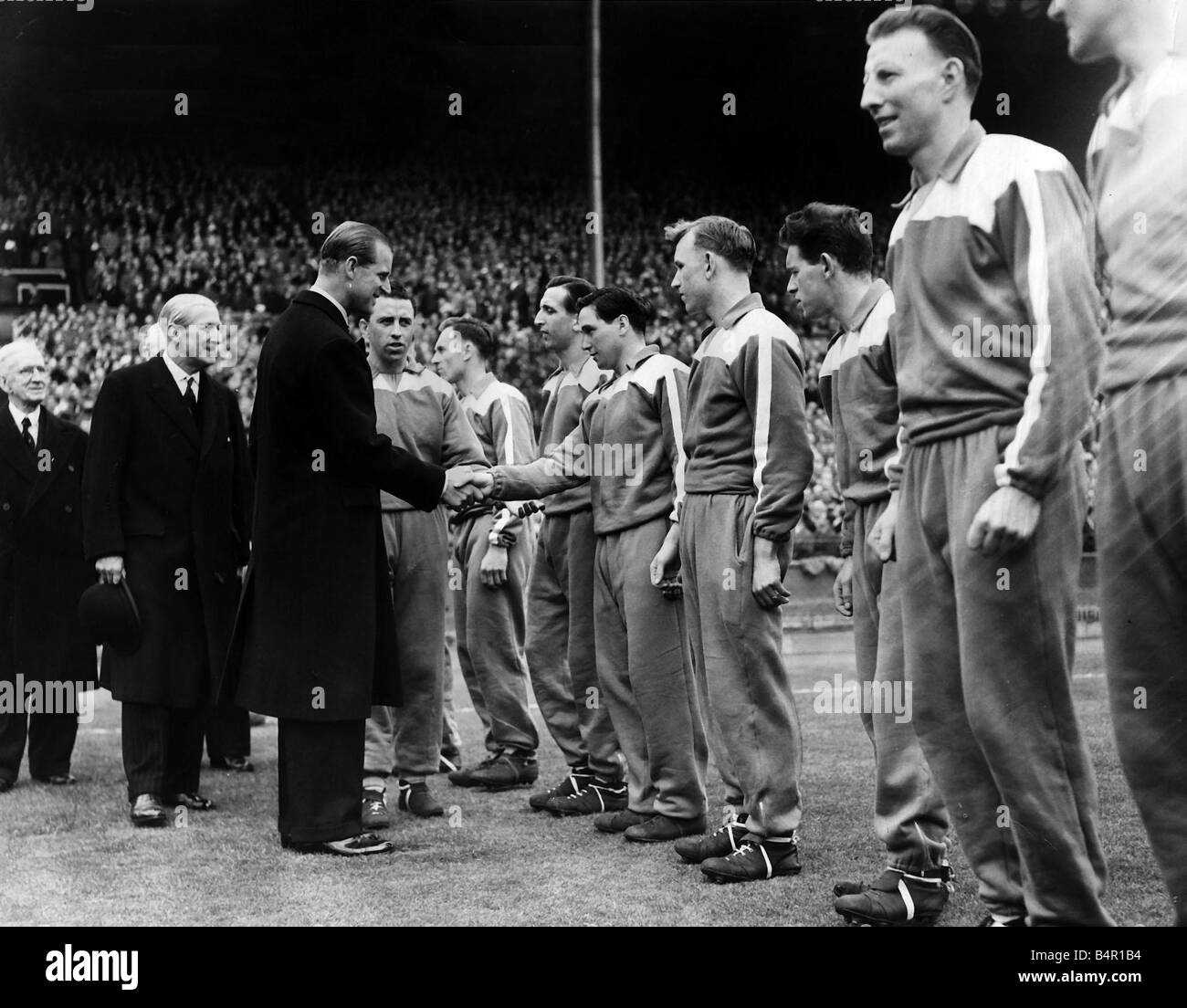 Prince Philip Duke of Edinburgh shaking hands with Manchester City Team ...