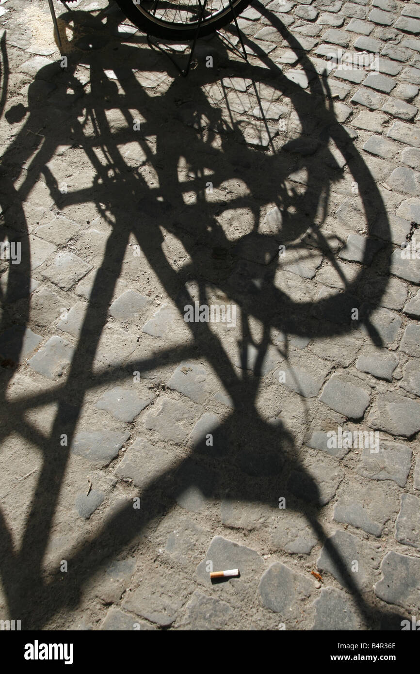 bikes shadow on sidewalk road in sun Stock Photo - Alamy