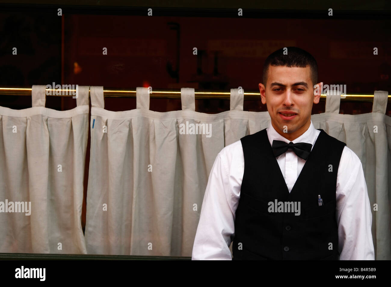 A young Morocco Arab man working for a restaurant located in Brussels ...