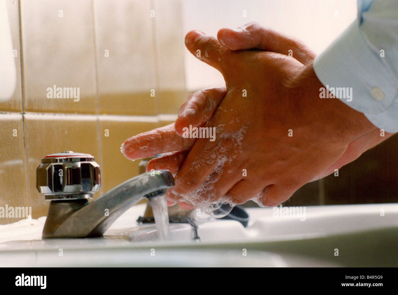 Someone washing their hands Stock Photo - Alamy