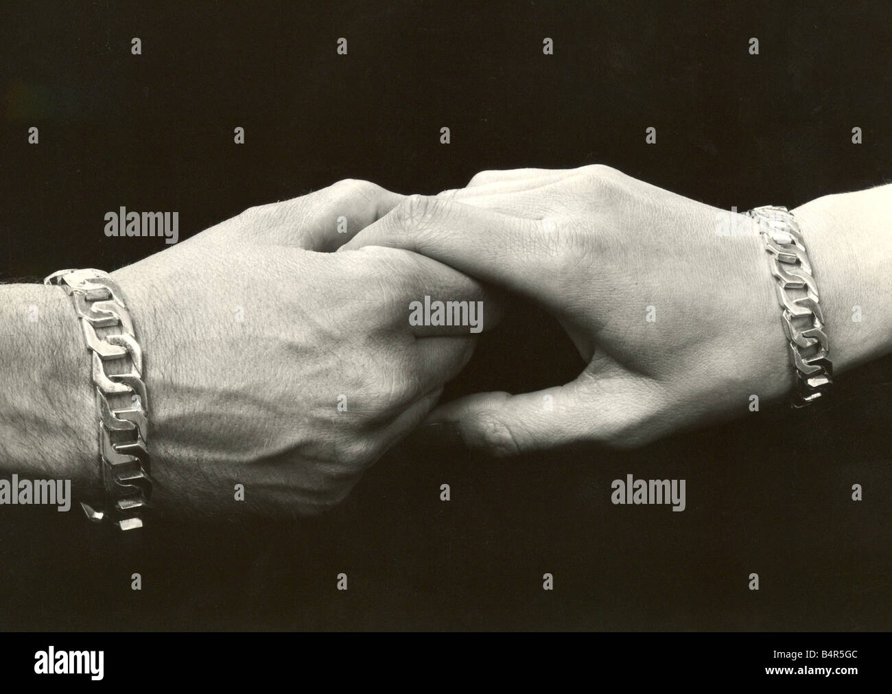 A couple holding hands Stock Photo - Alamy