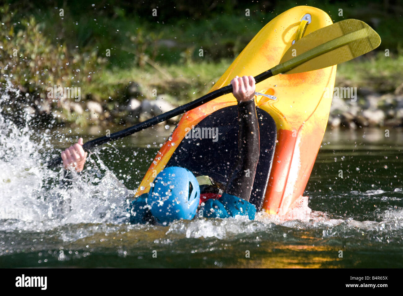 expert white water kayak paddler performing tricks Stock Photo - Alamy