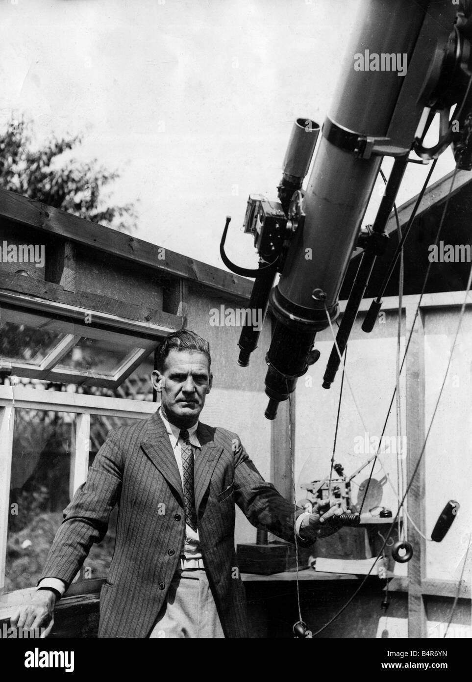 Actor Will Hay seen here with his 12 and a half foot telescope in his ...
