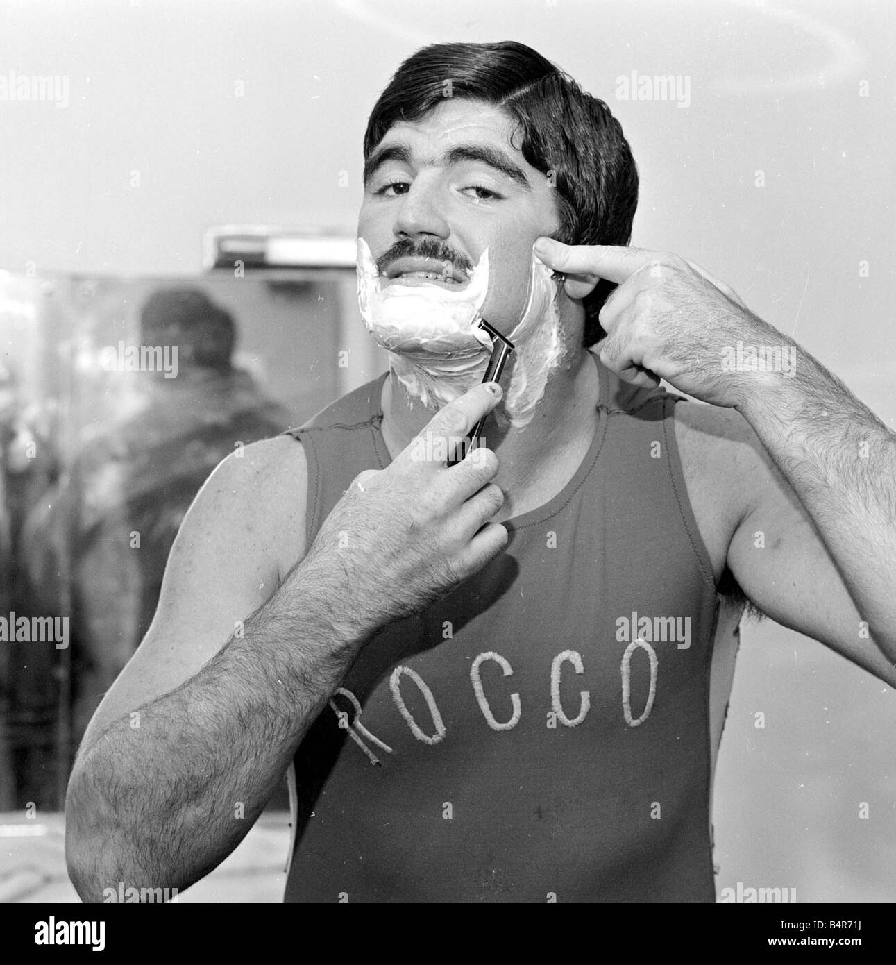 Wrestler Mark Rollerball Rocco seen here taking a shave before a bout ...