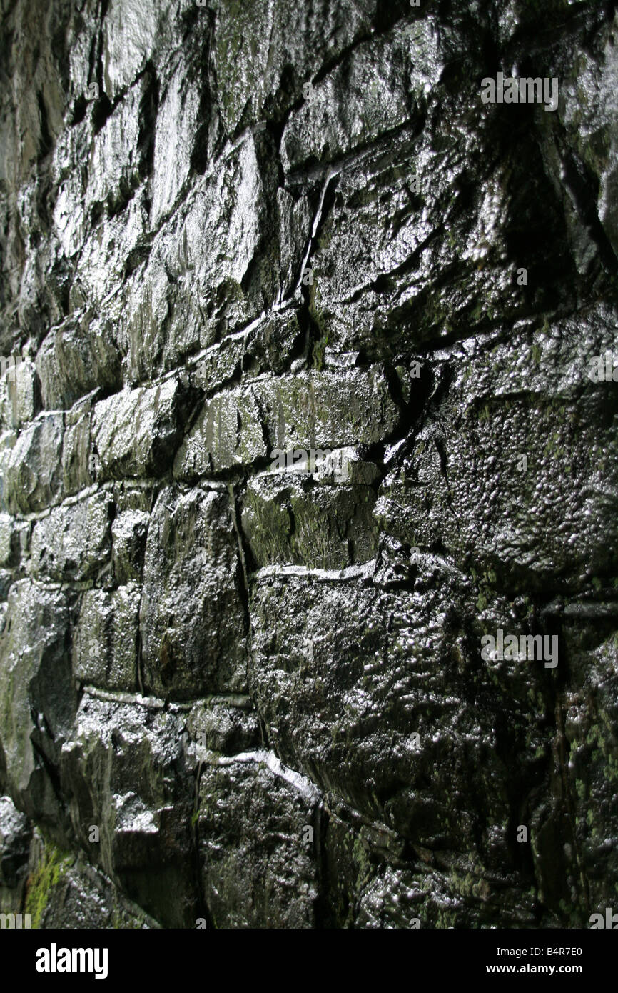 detail of dark damp wet stone wall in alley way Stock Photo - Alamy